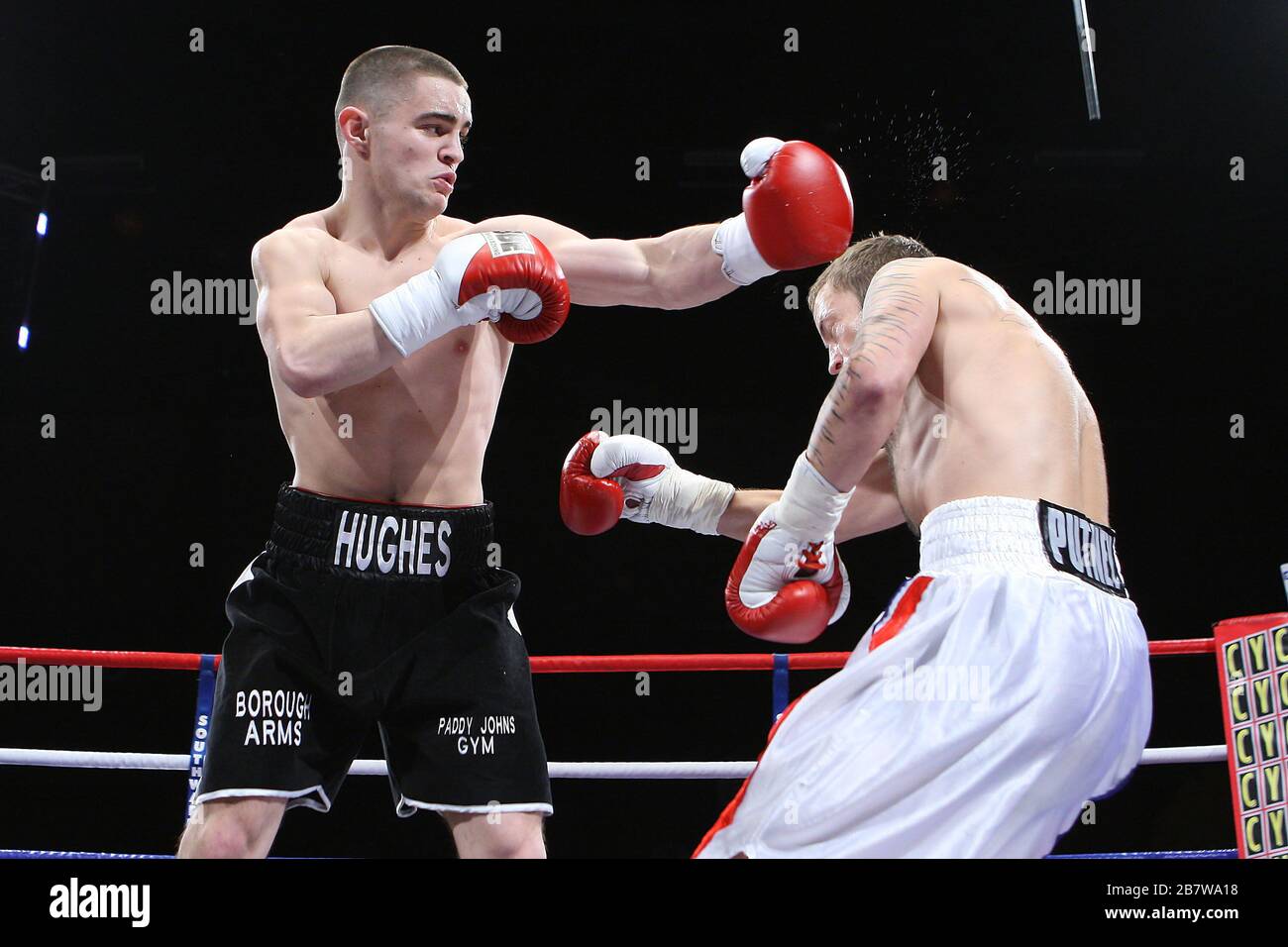 Joe Hughes (black shorts) defeats Gavin Putney in a Welterweight boxing ...