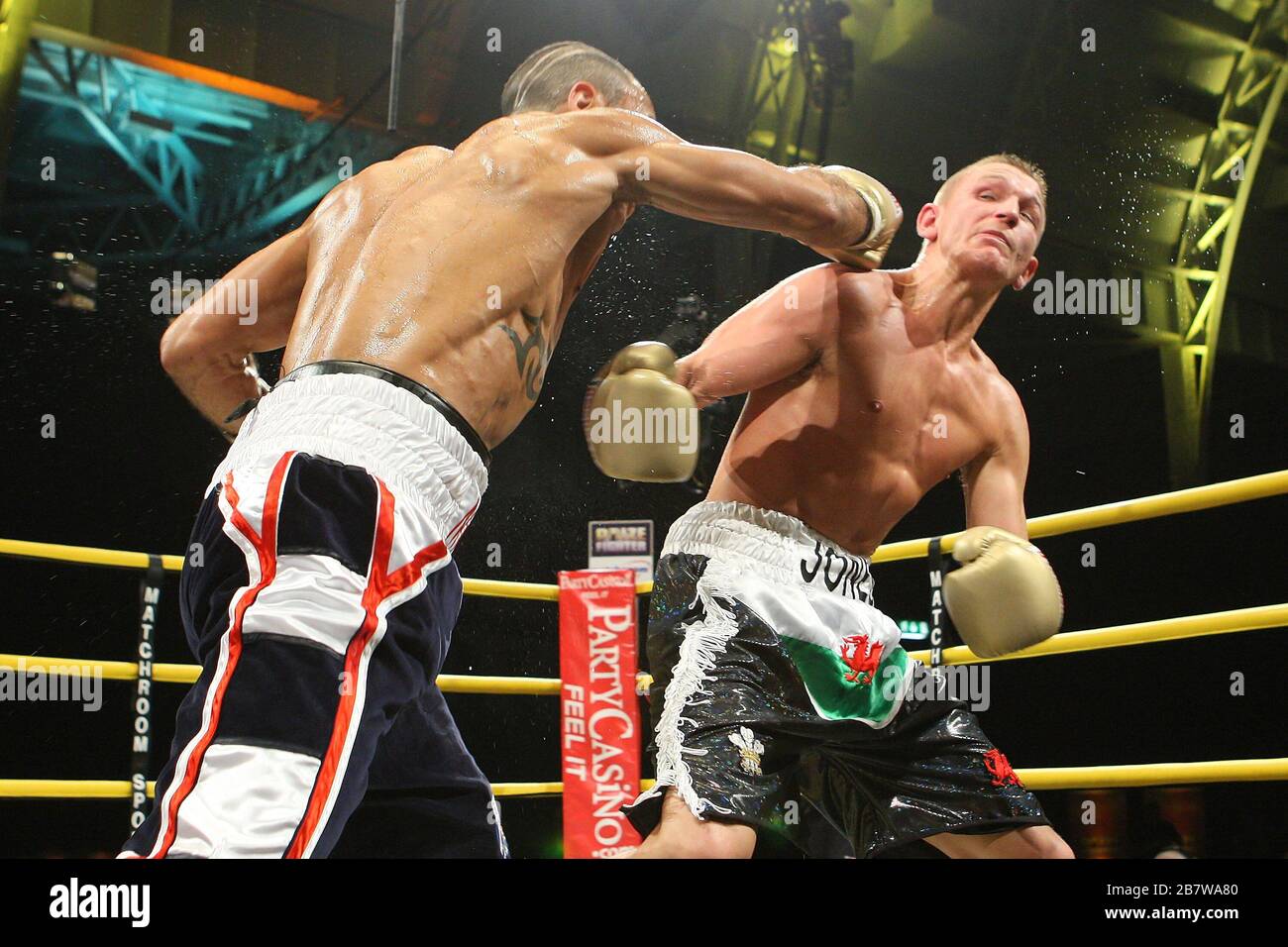 Young Mutley (dark blue shorts) defeats Barrie Jones in the Quarter ...