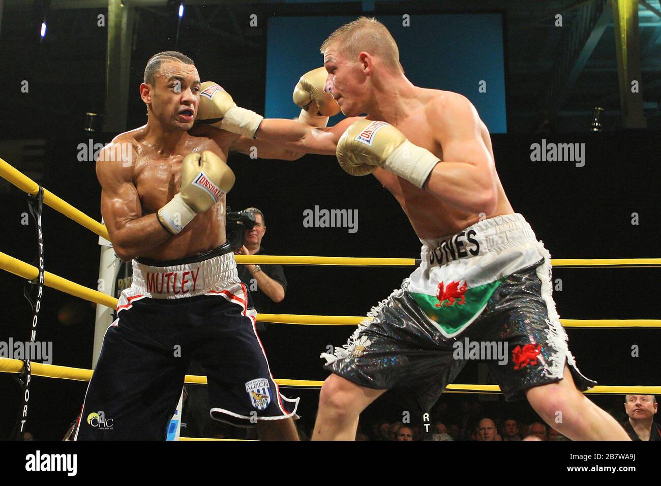 Young Mutley (dark blue shorts) defeats Barrie Jones in the Quarter ...