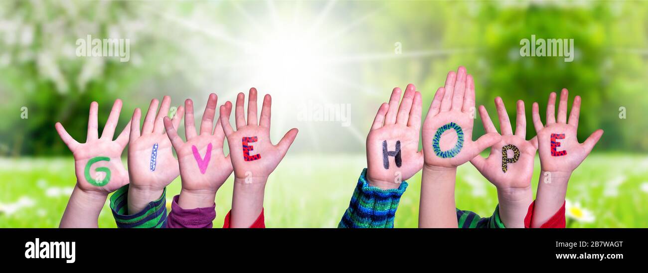 Children Hands Building Word Give Hope, Grass Meadow Stock Photo - Alamy