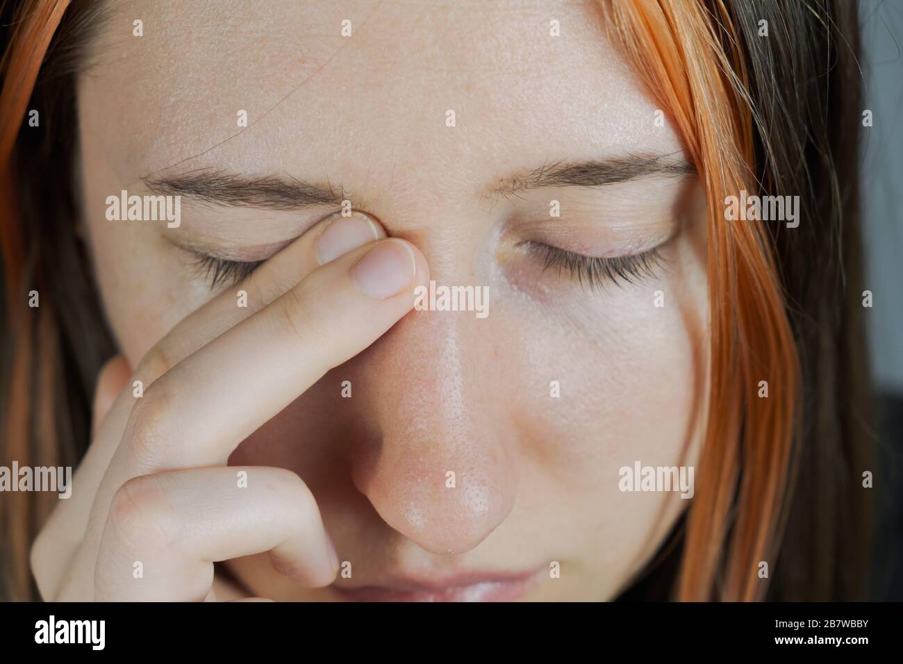 Touching face with hands, concept of bringing infection to eyes. Woman ...