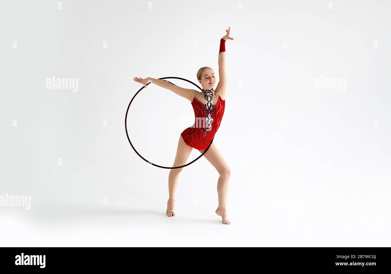 Young gymnast getting ready for competition on white background Stock ...