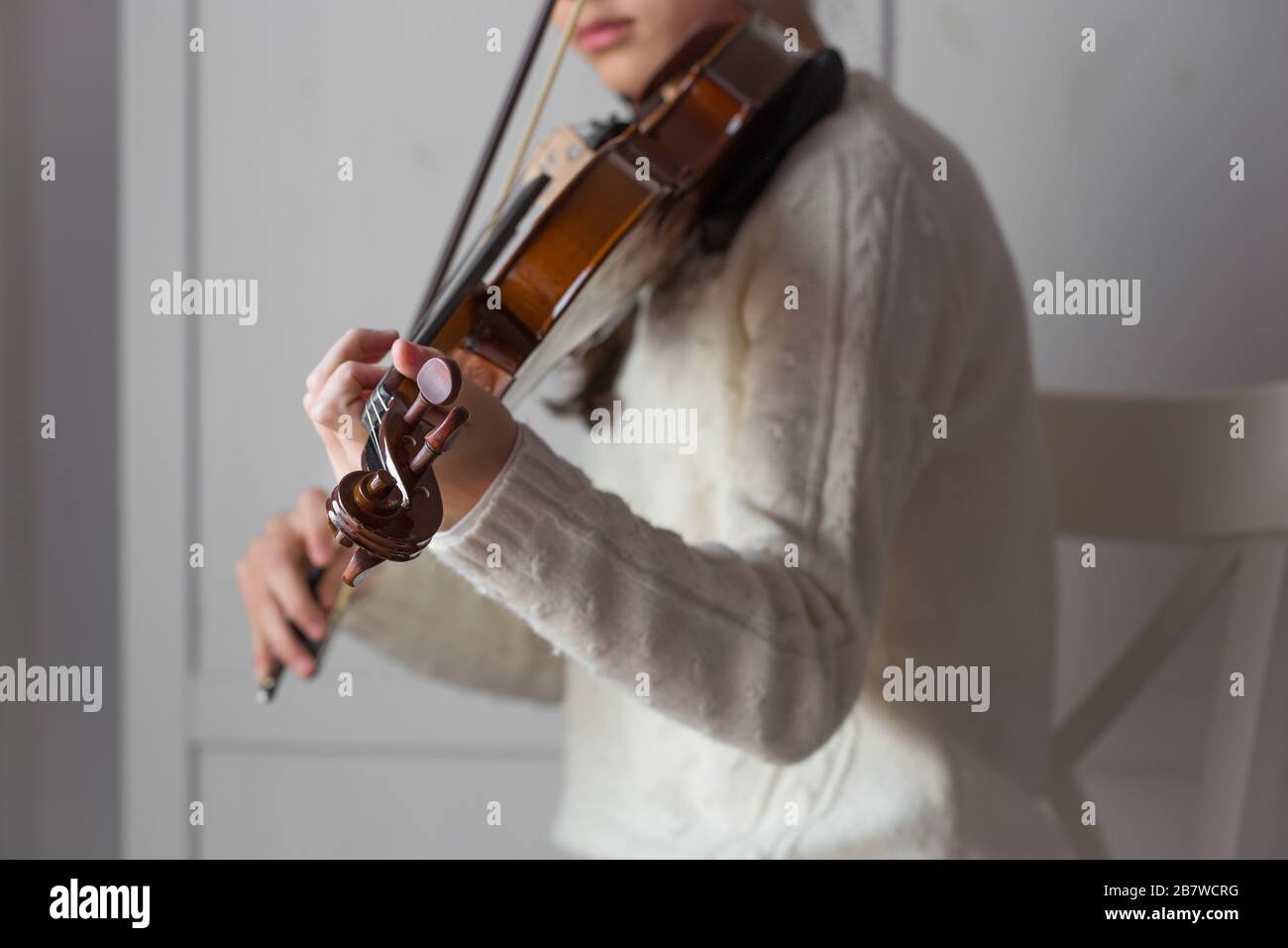 Young student practice violin at home with white background Stock Photo ...