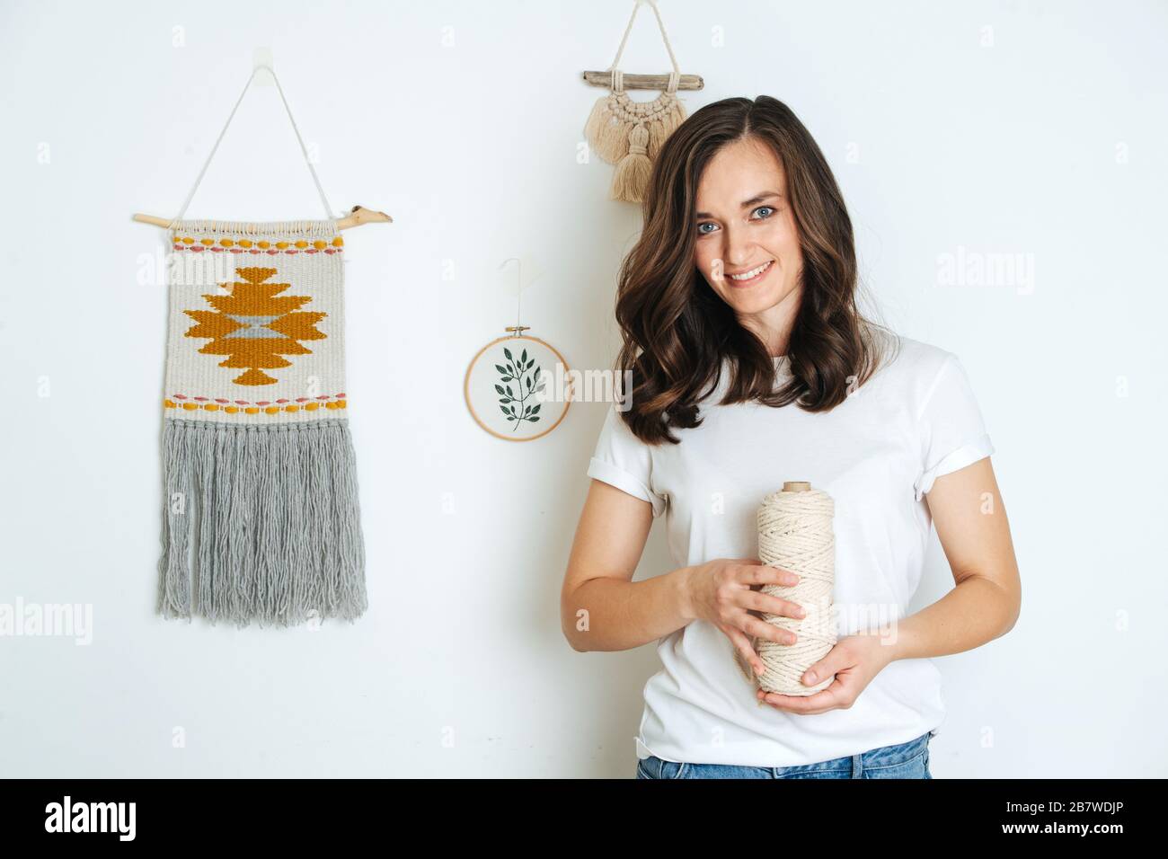 Portrait of a professional girl in macrame weaving Stock Photo - Alamy