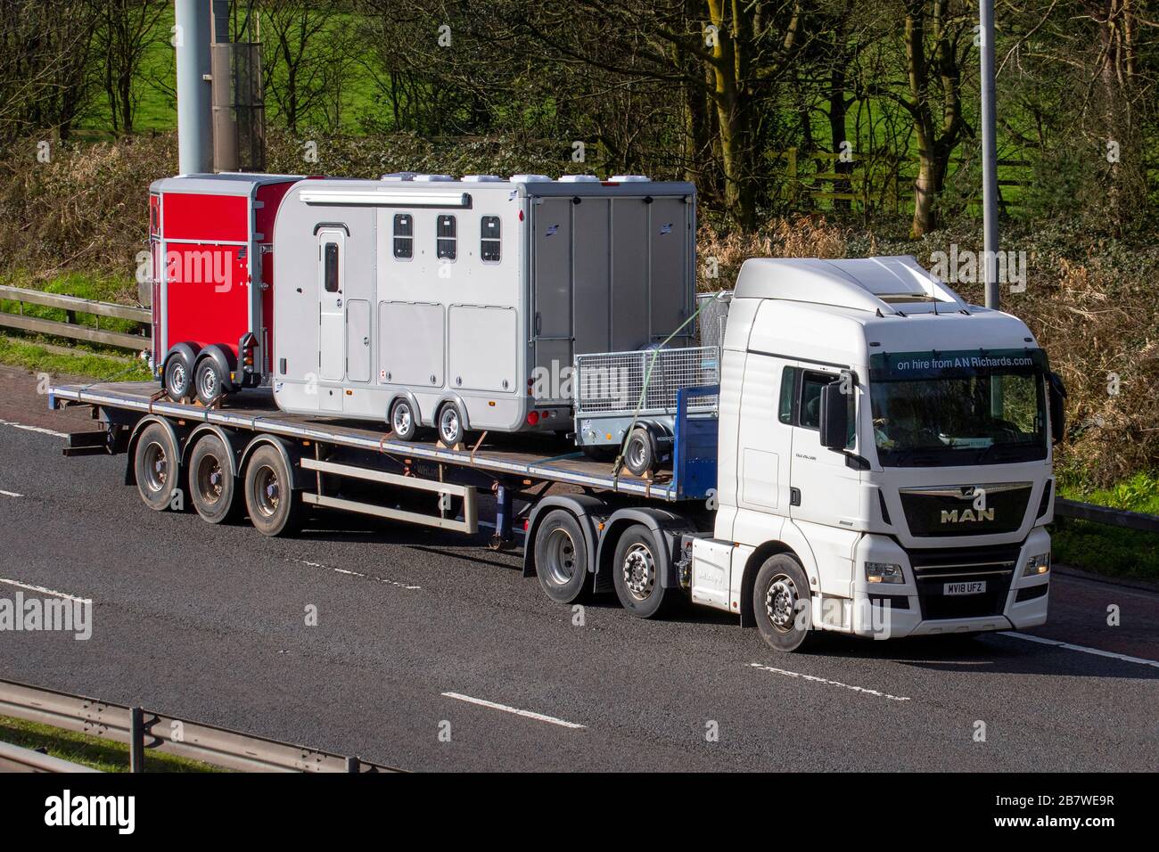 Haulage delivery trucks transporting Ivor Williams caravans and ...