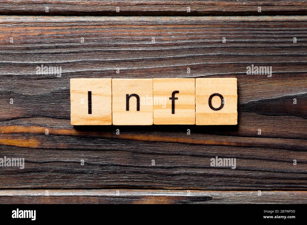 Info word written on wood block. Info text on table, concept Stock ...