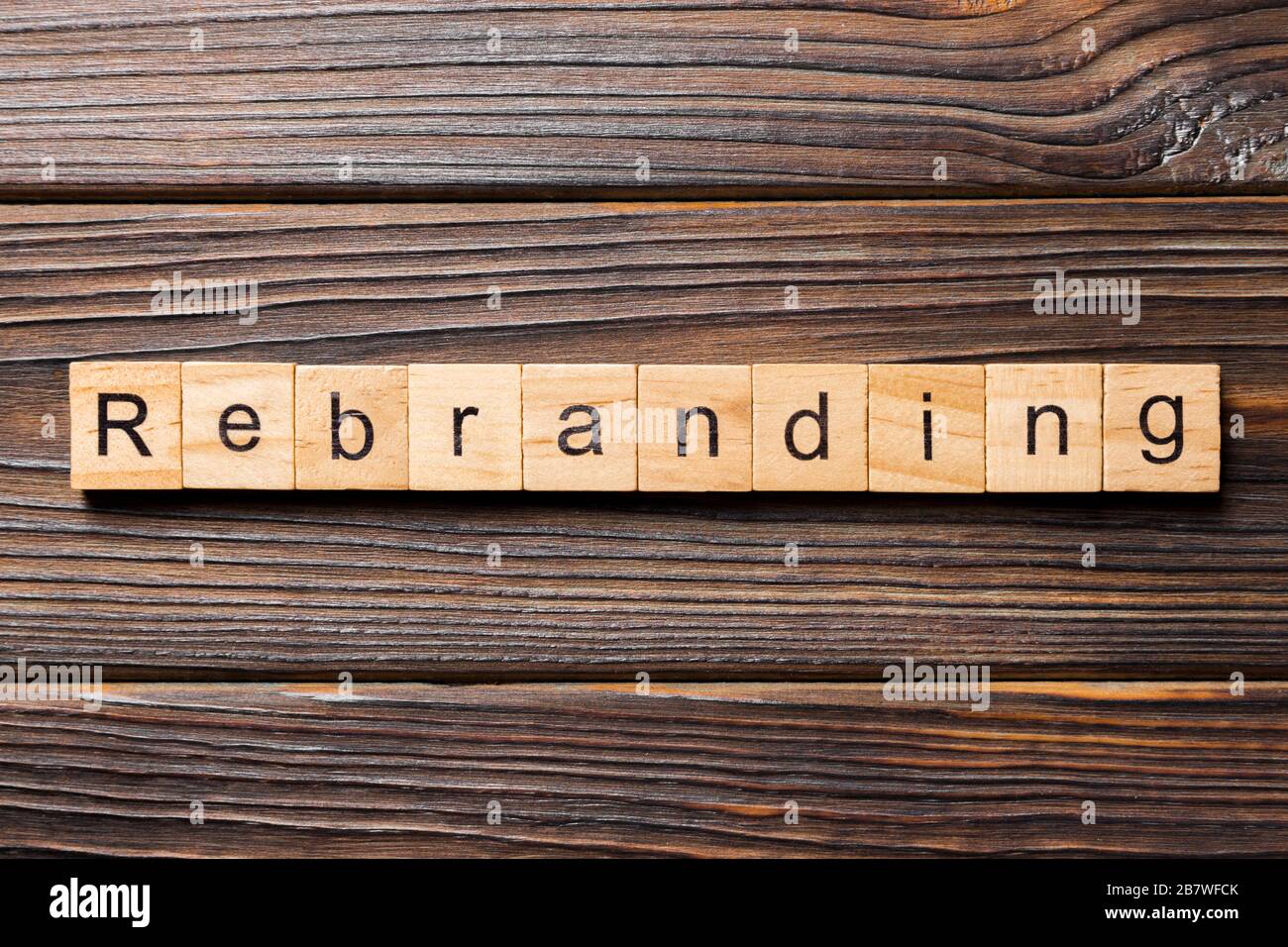 rebranding word written on wood block. rebranding text on table ...