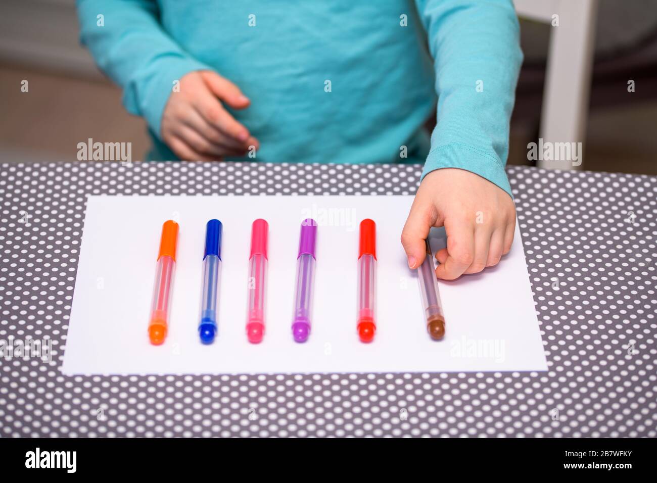 Child holding pen hi-res stock photography and images - Alamy