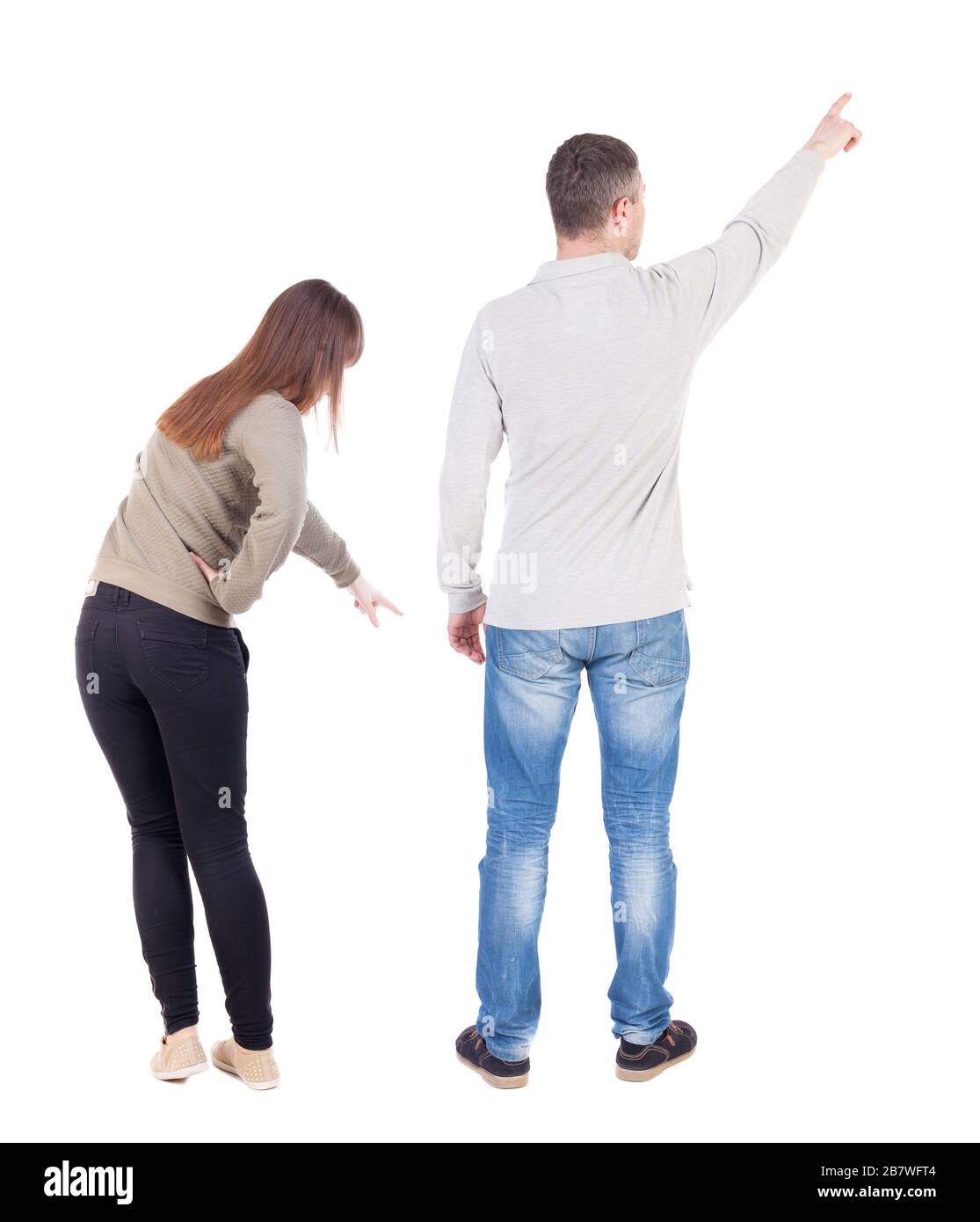 Back view of couple in sweater pointing. Rear view people collection ...