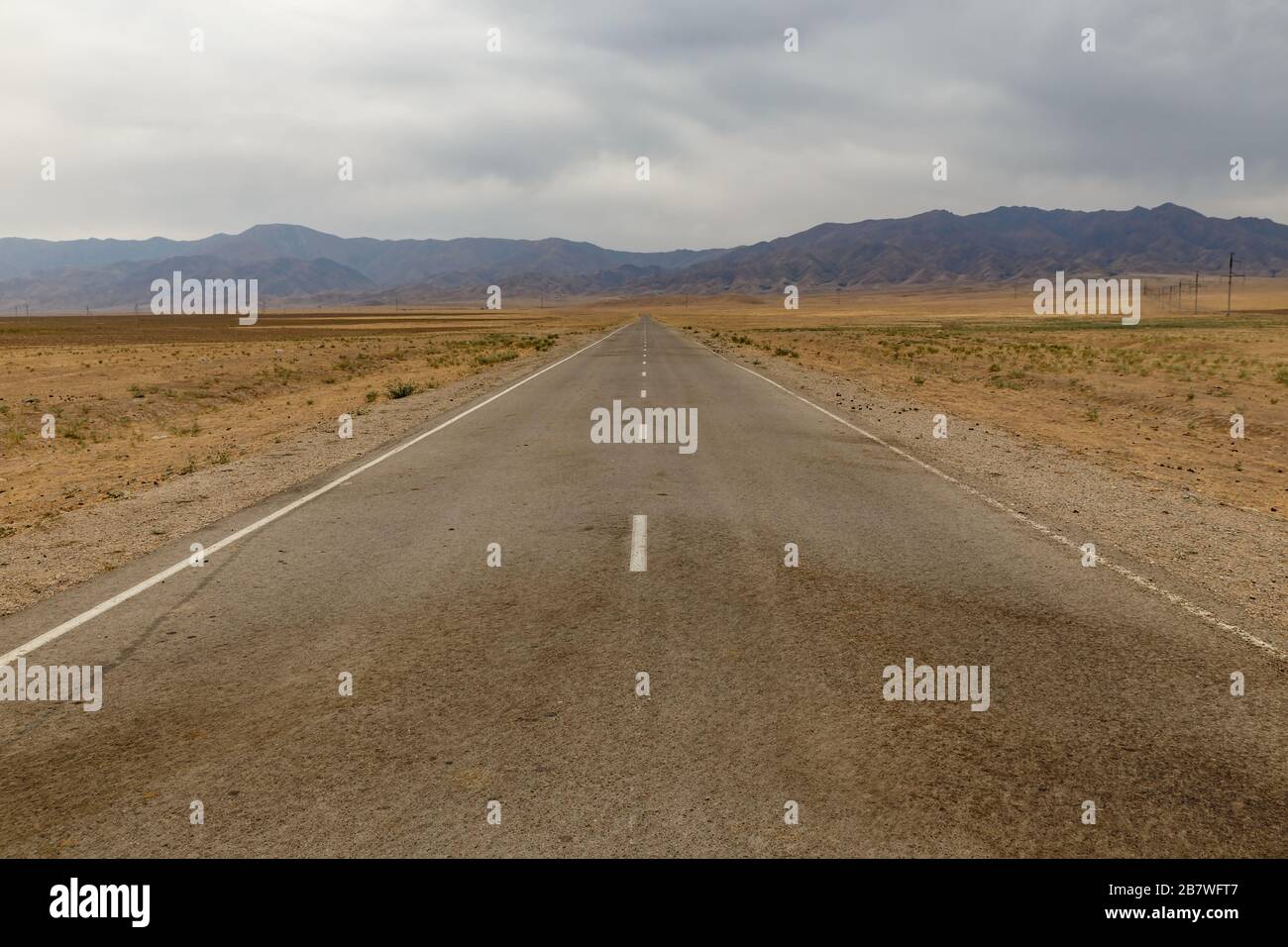 Asphalt road to the Akyrtas palace complex in the Jambyl region of ...