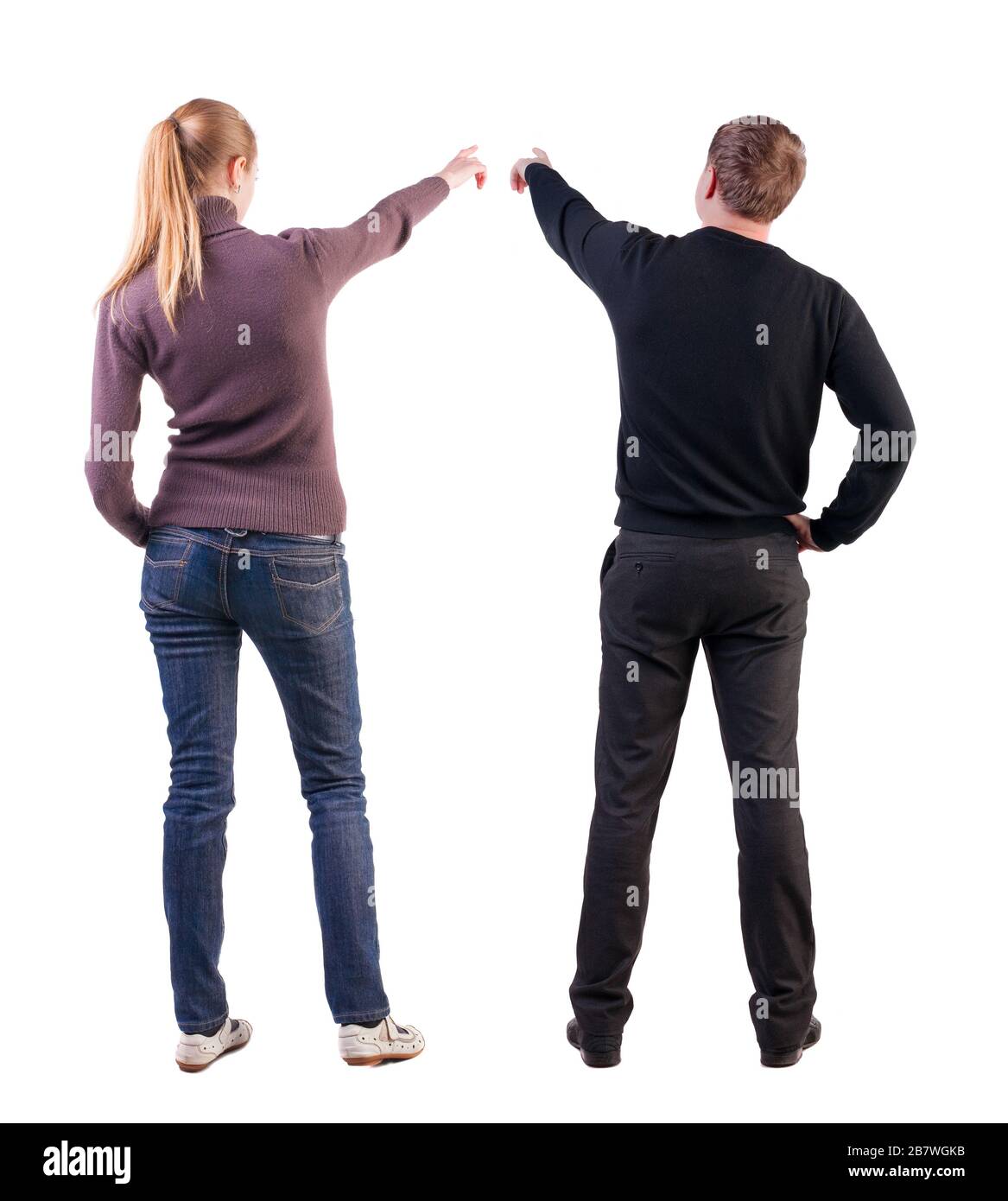 Back view of couple in sweater pointing. Rear view people collection ...