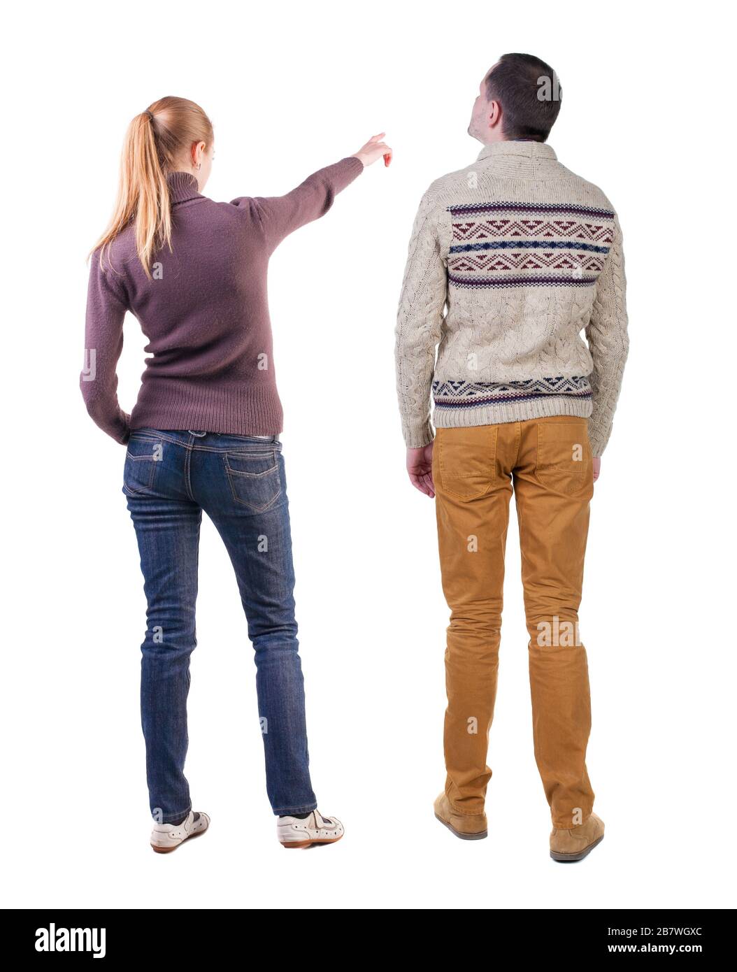 Back view of couple in sweater pointing. Rear view people collection ...