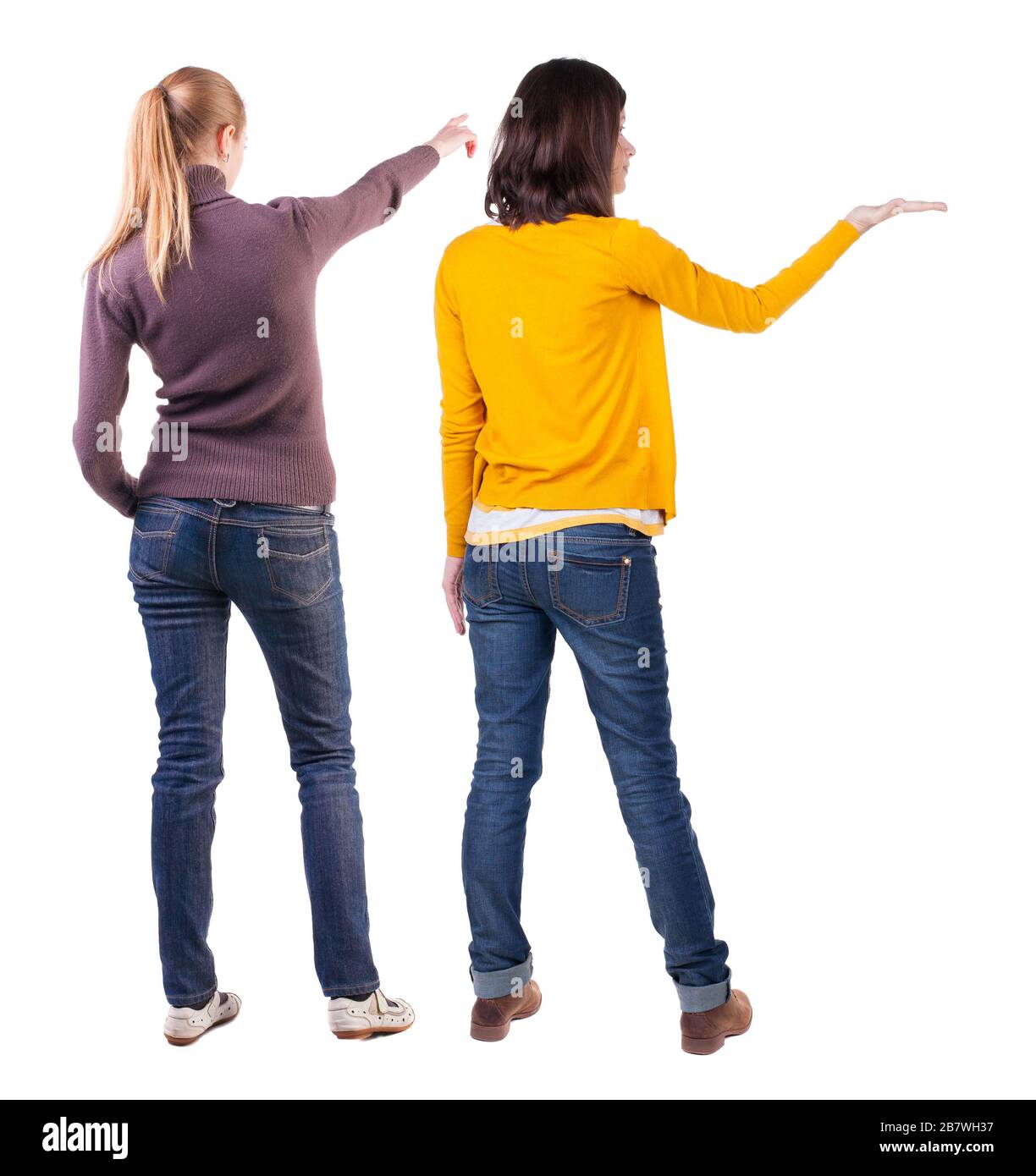 Back view of two pointing girl in sweater. Rear view people collection ...