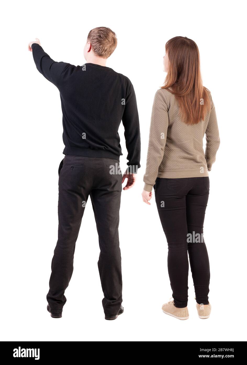 Back view of couple in sweater pointing. Rear view people collection ...