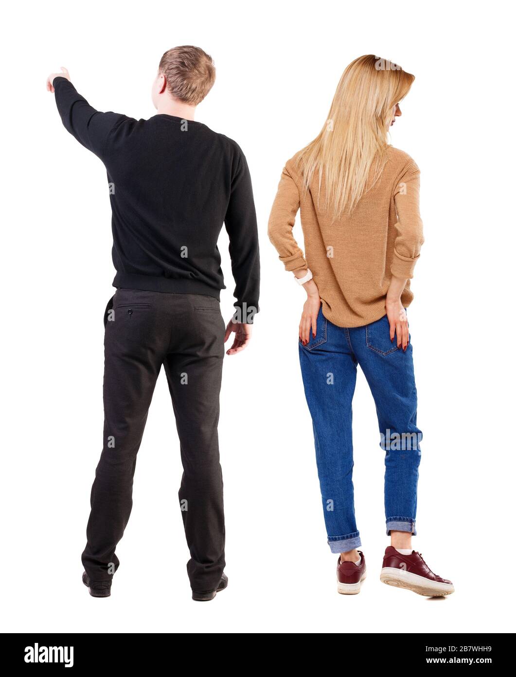 Back view of couple in sweater pointing. Rear view people collection ...