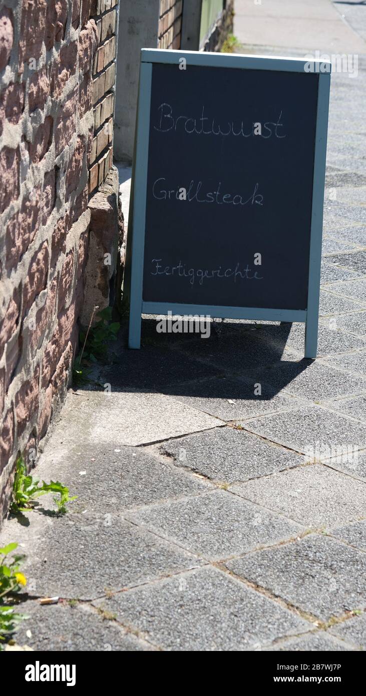 Hand-written Sign on German Pavement Advertising Bratwurst Stock Photo ...