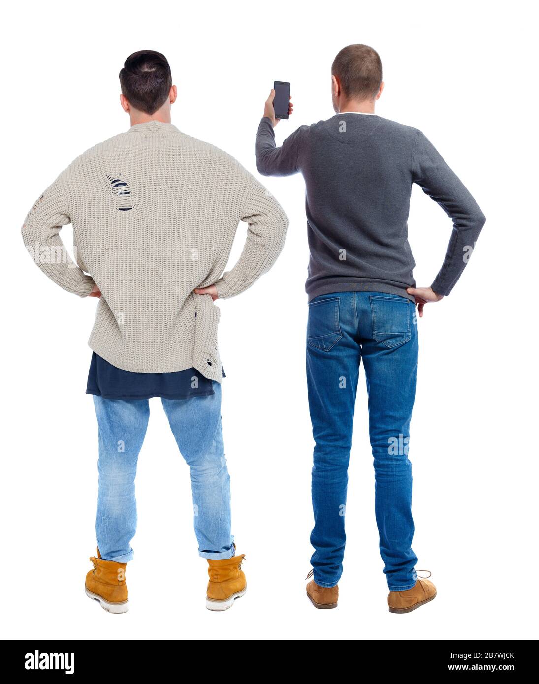 Back view of two man in sweater with mobile phone. Rear view people ...