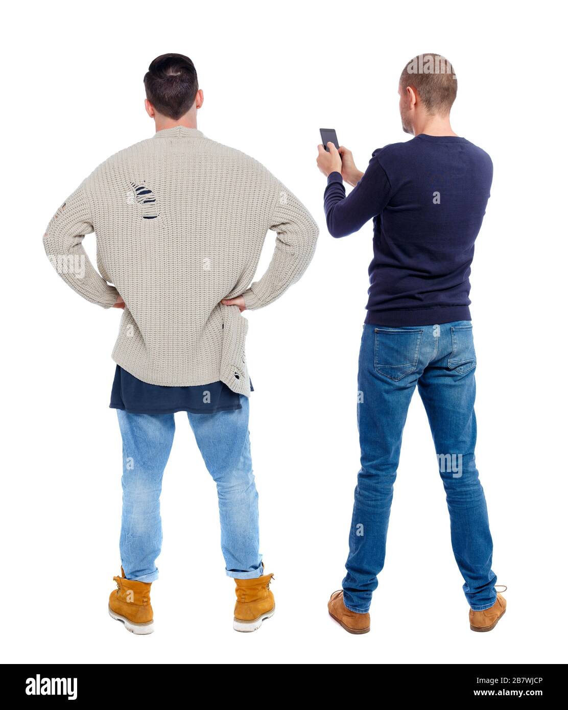 Back view of two man in sweater with mobile phone. Rear view people ...