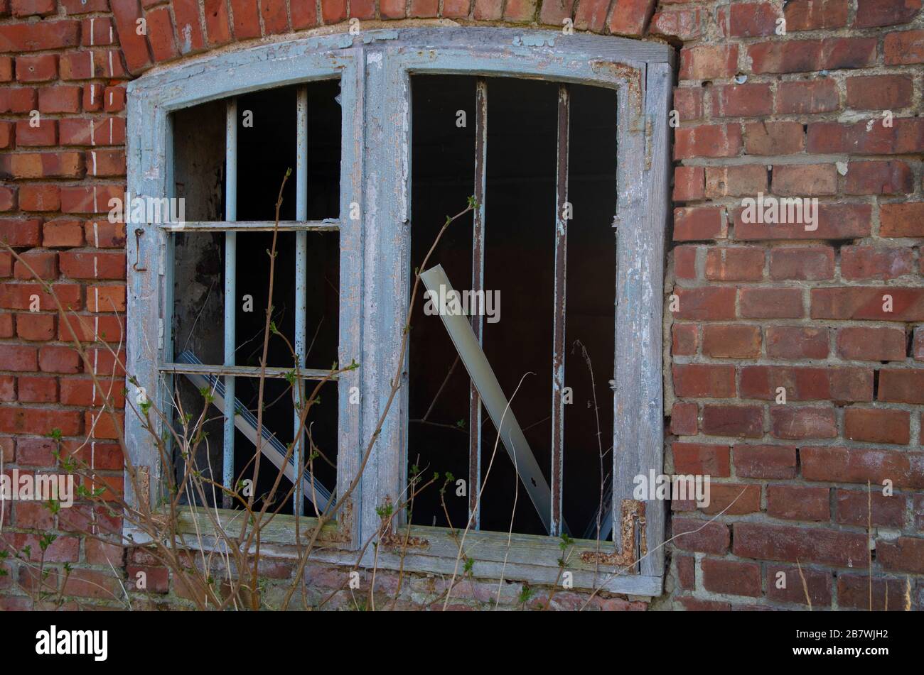 A window in a ruined house, the decline of the economy shows ...