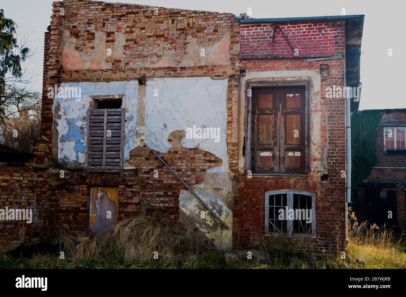 A crumbling house, a dilapidated dwelling as a symbol of economic ...