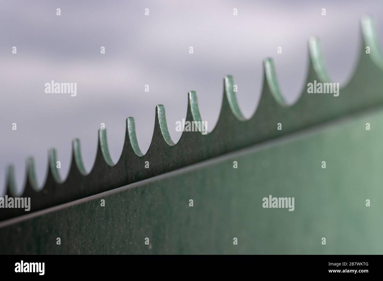 Selective focus on iron spiked border fence Stock Photo - Alamy
