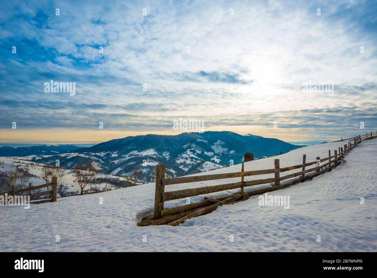 Beautiful panorama of the mountain ranges covered with snow and divided ...
