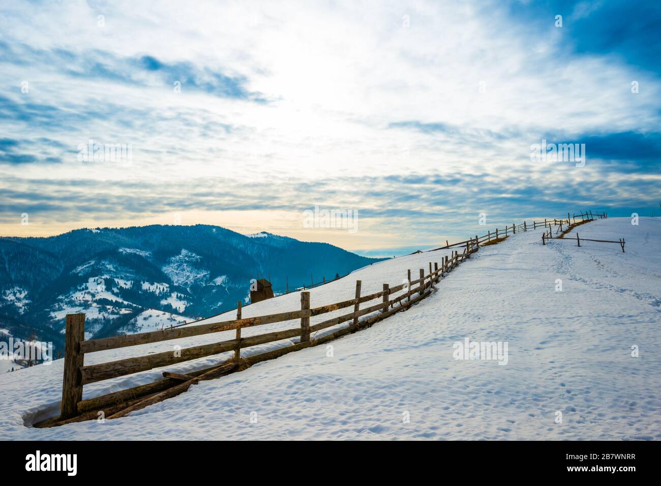 Beautiful panorama of the mountain ranges covered with snow and divided ...