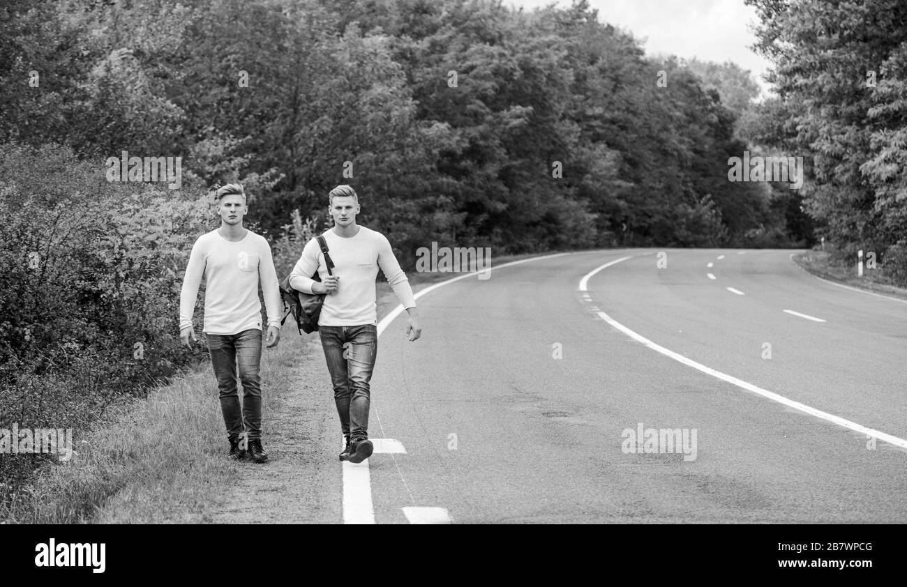 First and foremost. traveler hitchhiking on highway. on the way home ...