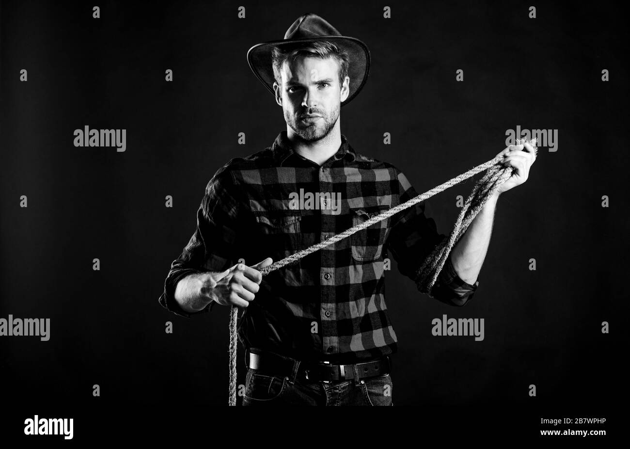 in texas. wild west rodeo. man in hat black background. western cowboy ...
