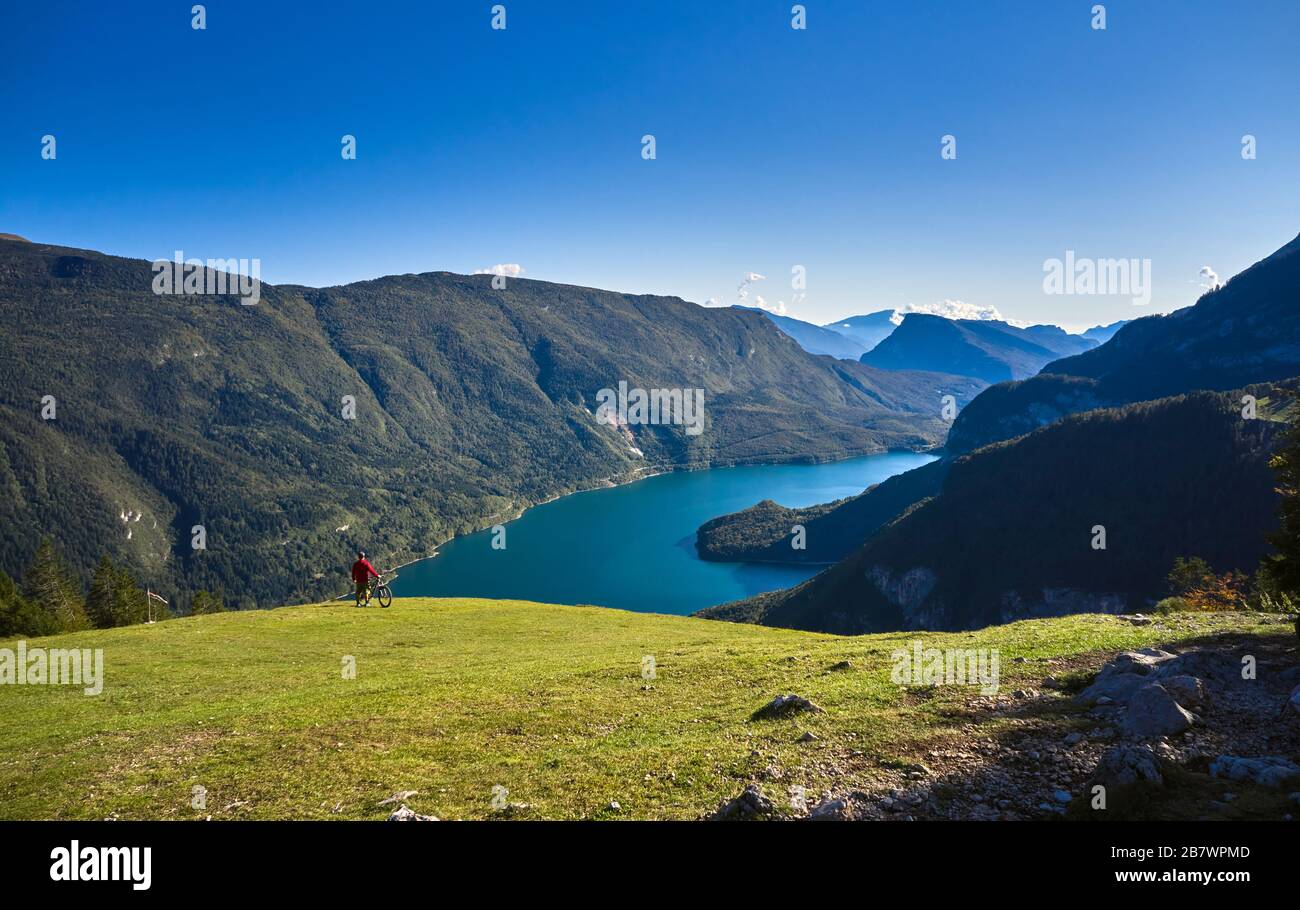 Aerial view over the beautiful Molveno town and Molveno lake, an alpine ...