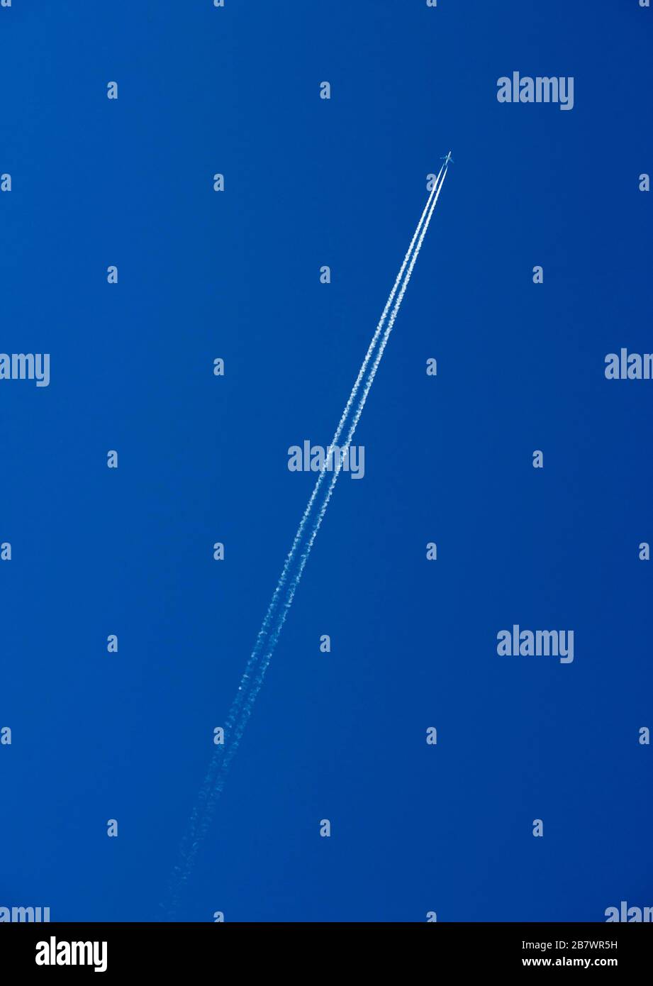 Aviation, Passenger aircraft with contrails, Austria Stock Photo - Alamy