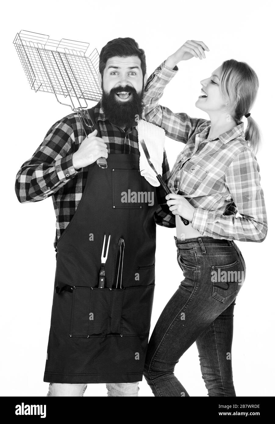 Bearded hipster and girl hold cooking grilling utensils white ...