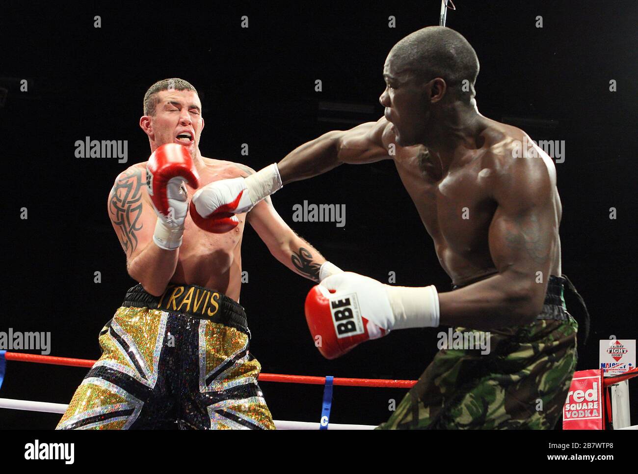 Travis Dickinson (yellow/black shorts) defeats Hastings Rasani in a ...