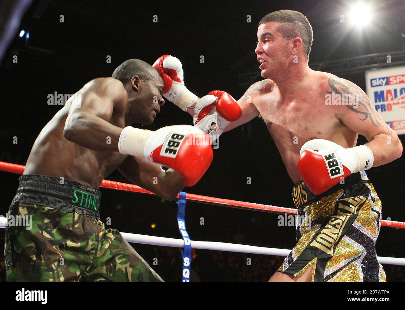 Travis Dickinson (yellow/black shorts) defeats Hastings Rasani in a ...
