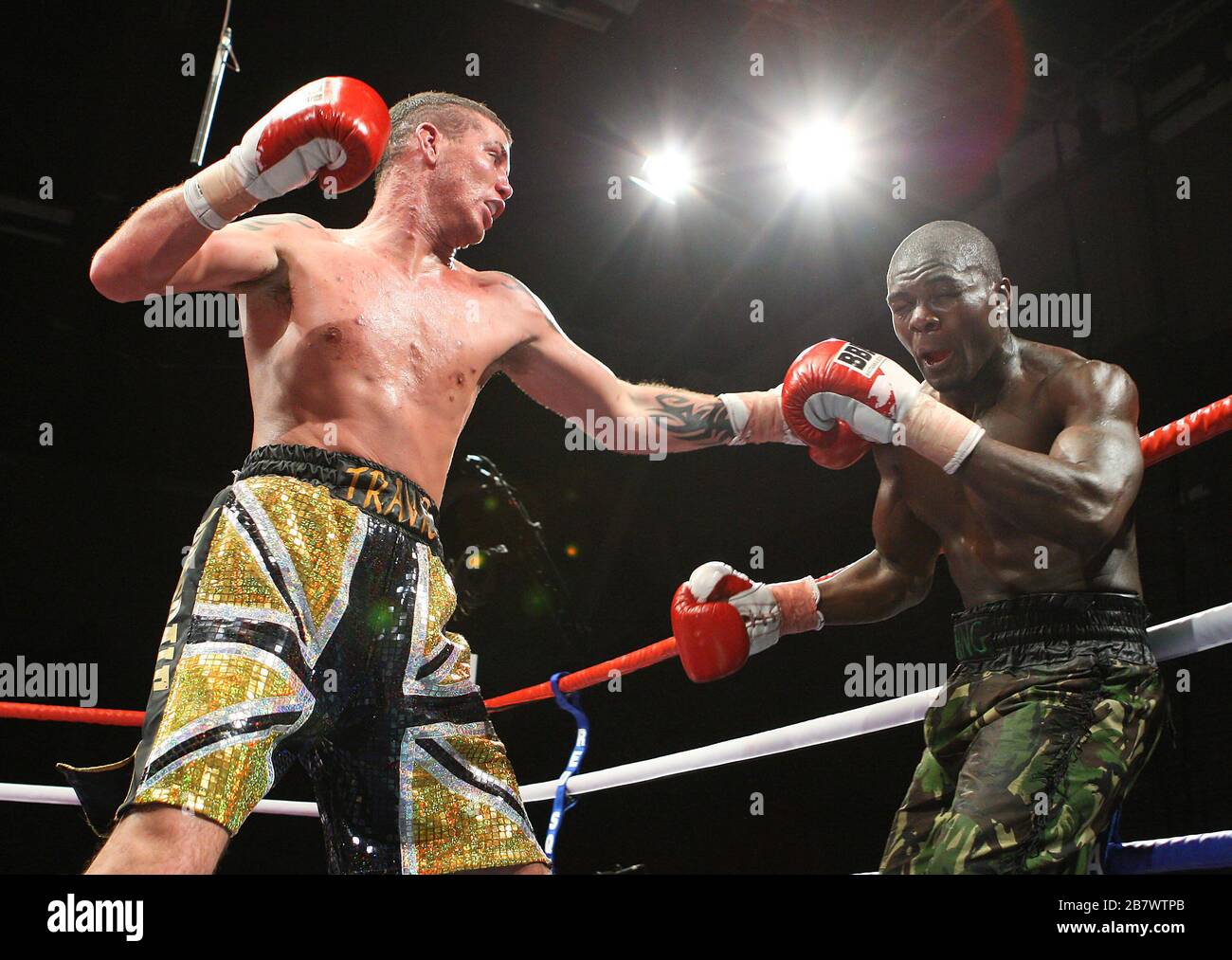Travis Dickinson (yellow/black shorts) defeats Hastings Rasani in a ...