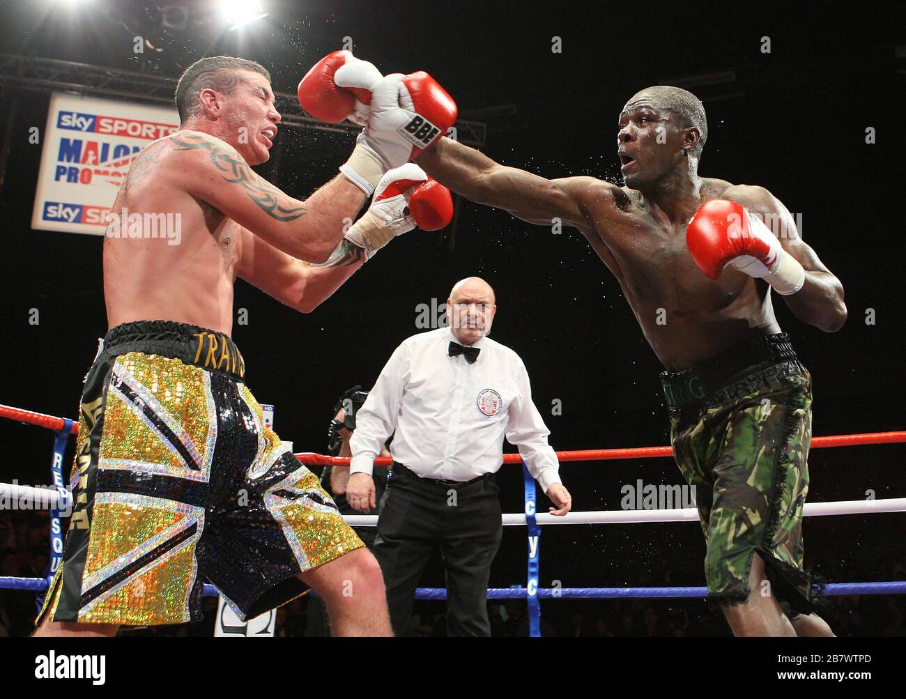 Travis Dickinson (yellow/black shorts) defeats Hastings Rasani in a ...