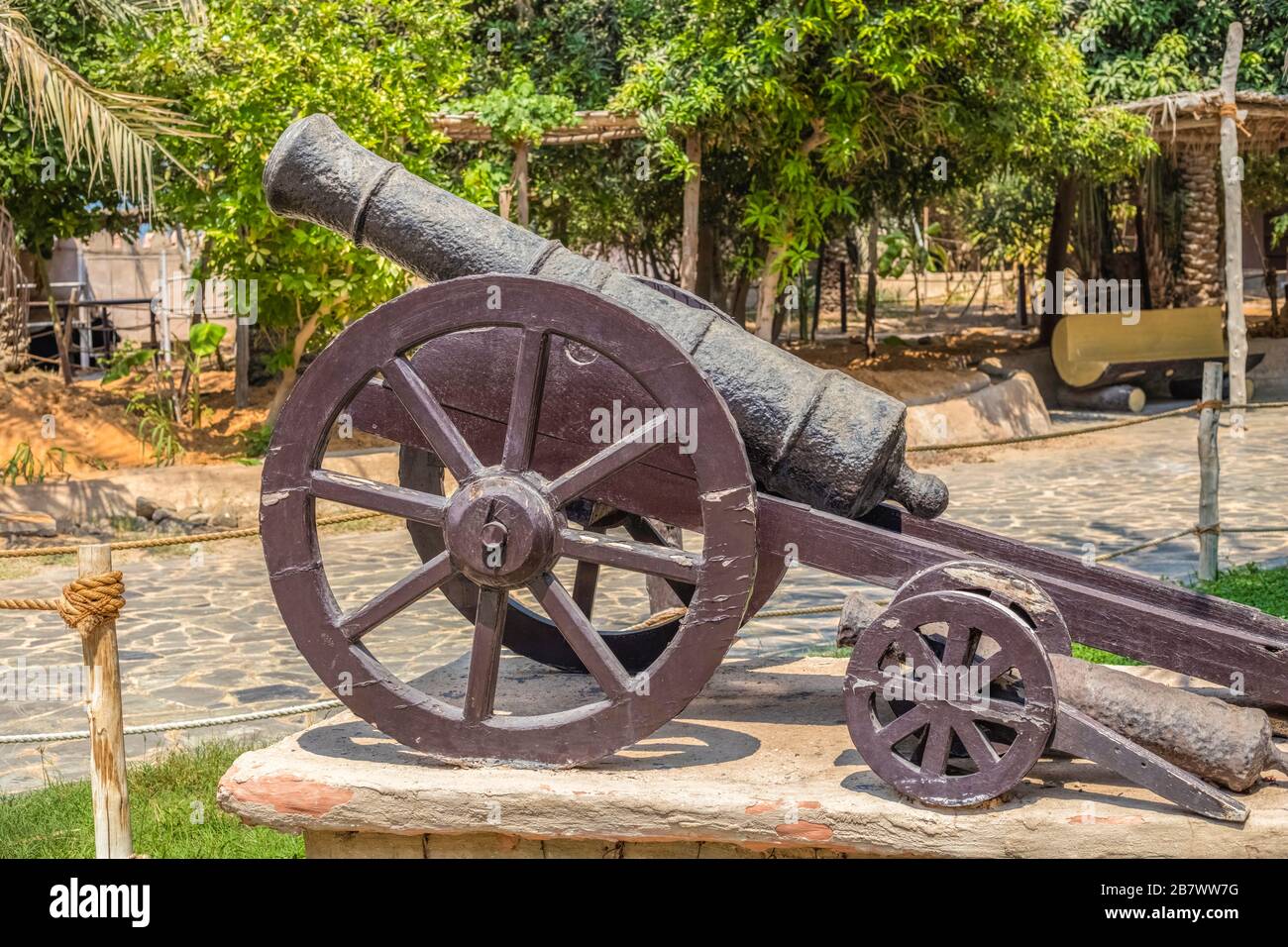 Antique cast iron guns large and small. Old black gun Stock Photo - Alamy
