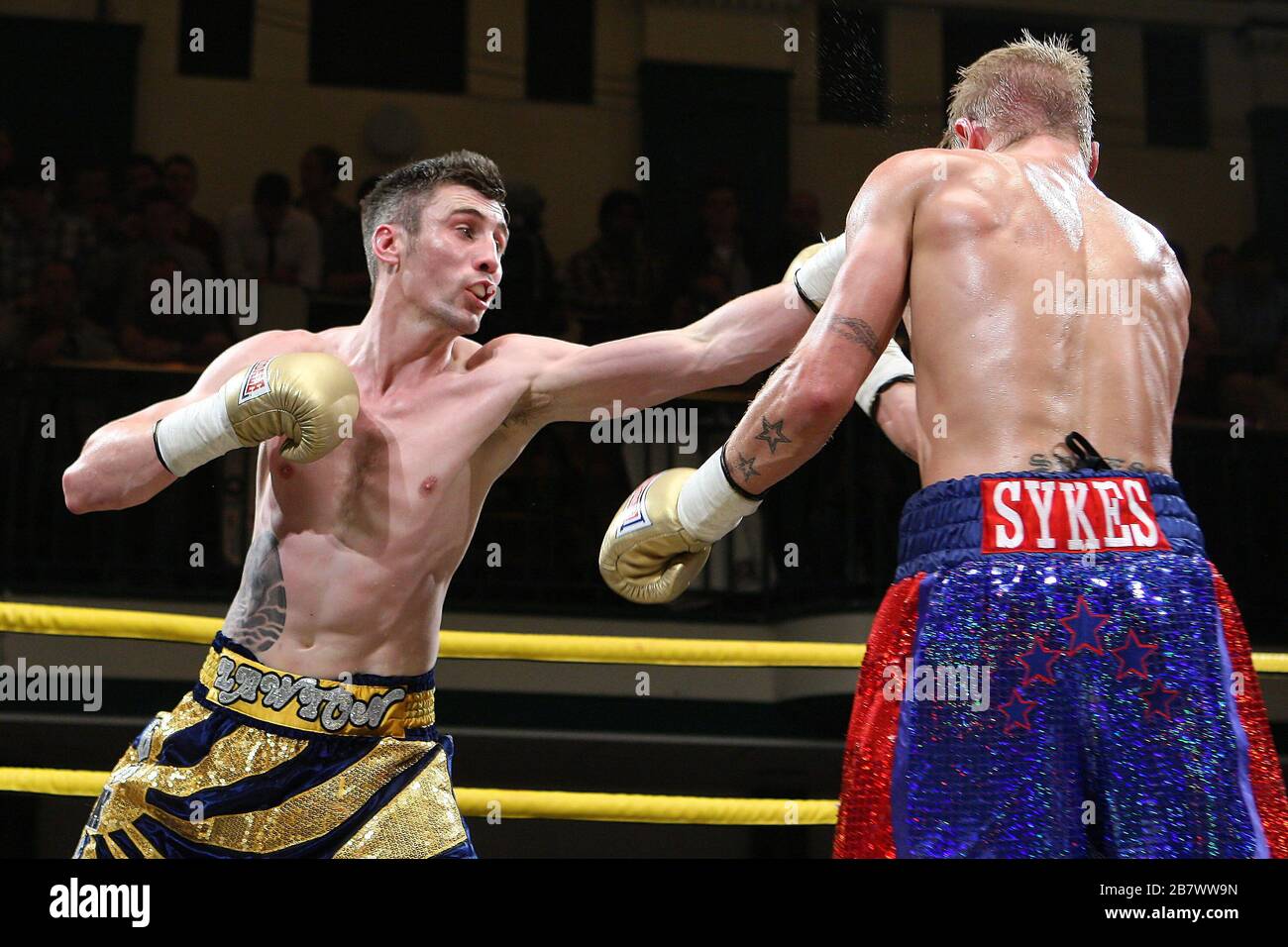 Gary Sykes (blue/red shorts) defeats Scott Lawton (gold/blue shorts) in ...