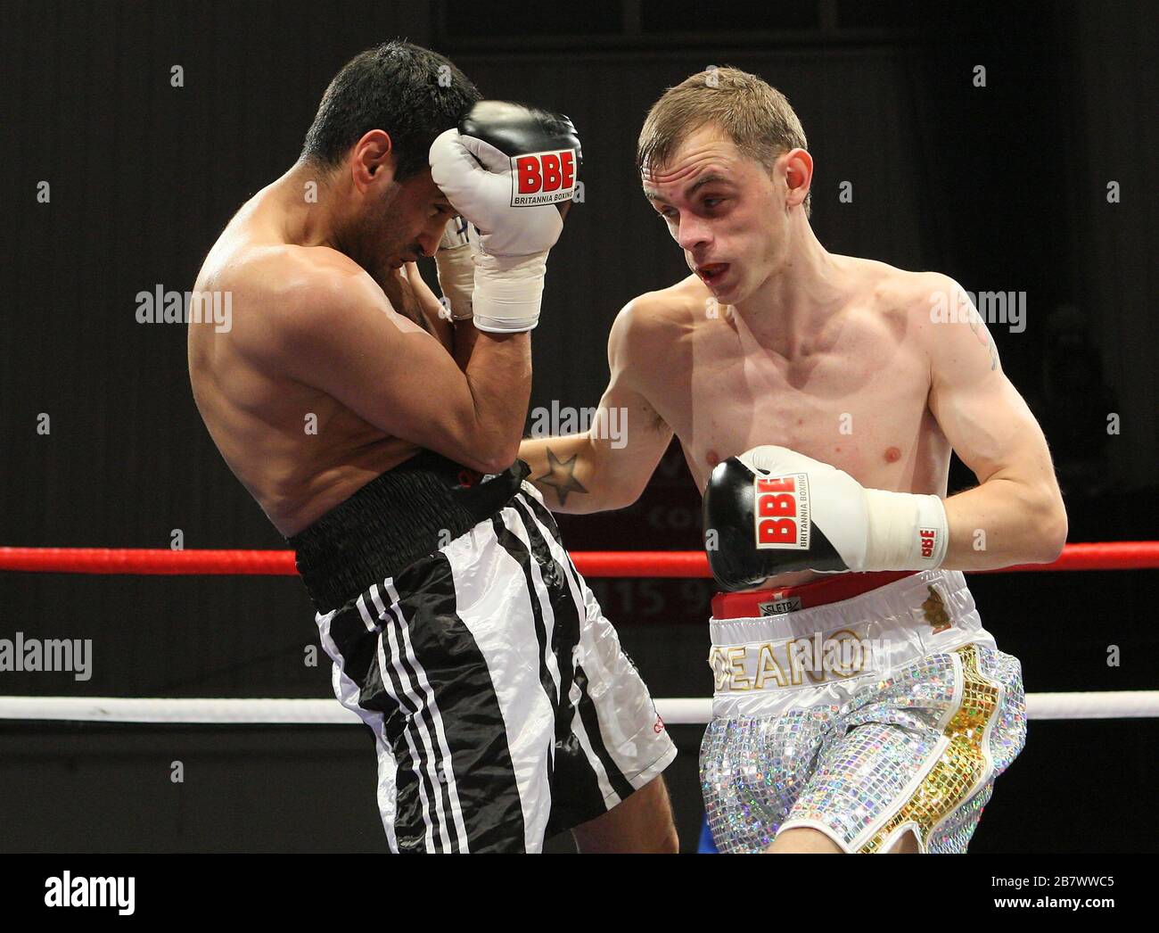 Leon Deans (white/gold shorts) defeats Sid Razak in a Lightweight ...