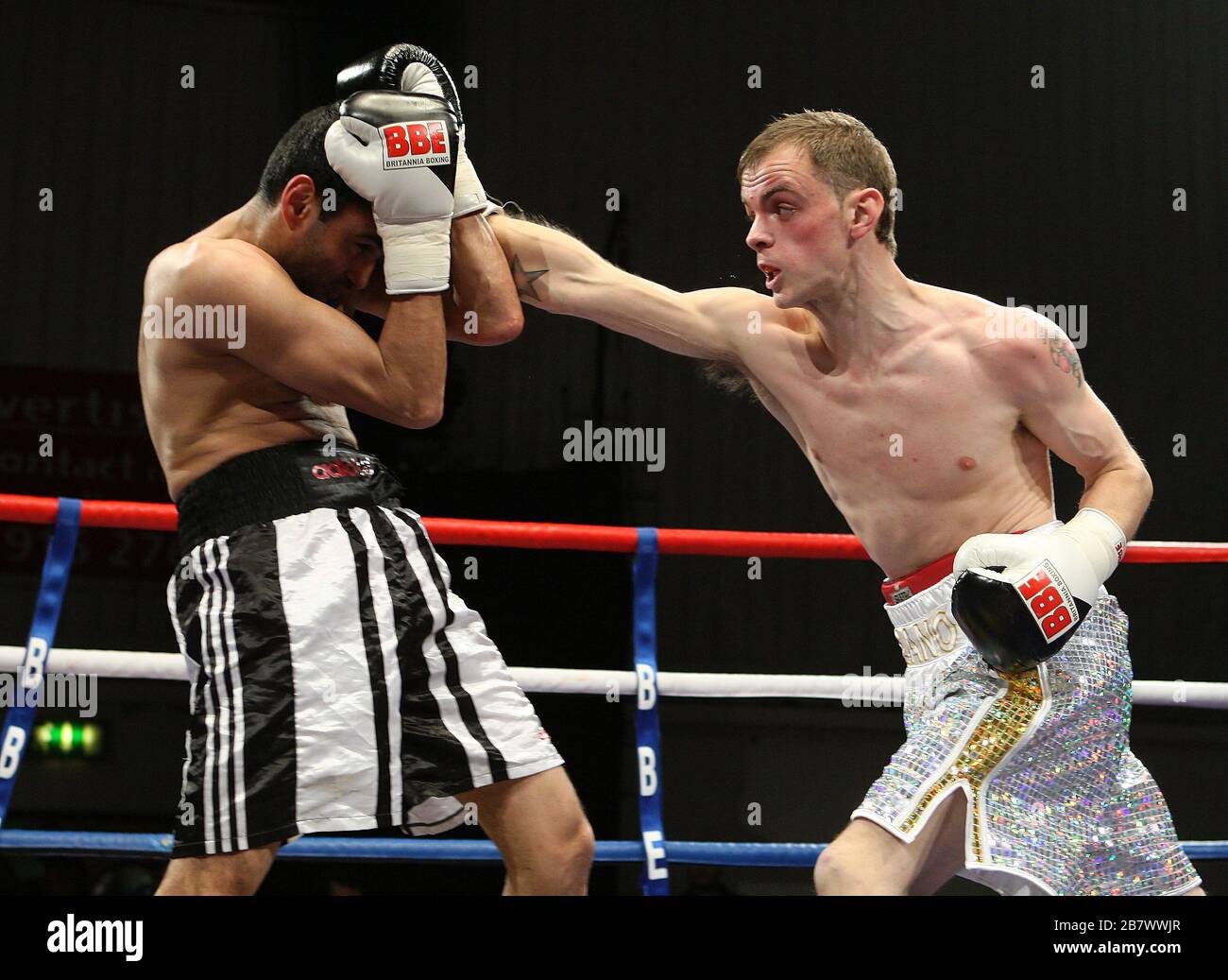 Leon Deans (white/gold shorts) defeats Sid Razak in a Lightweight ...