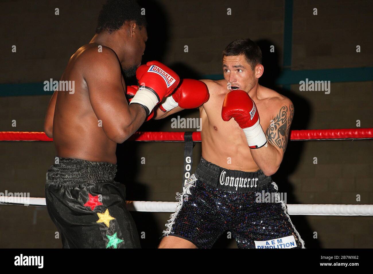 Tony Conquest (dark blue/silver shorts) defeats Prnce George Akrong in ...