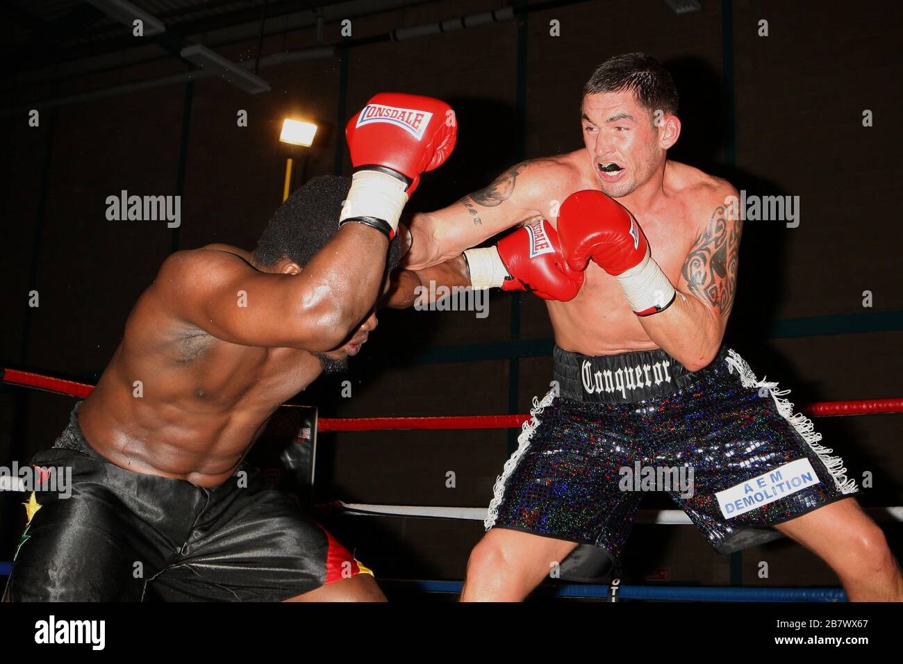 Tony Conquest (dark blue/silver shorts) defeats Prnce George Akrong in ...