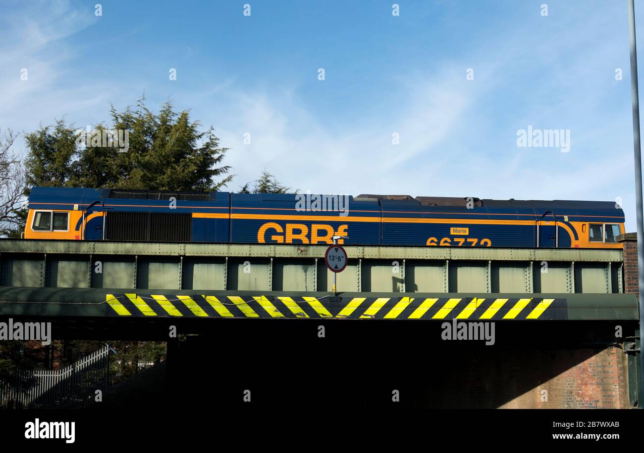 GBRf class 66 diesel locomotive crossing a railway bridge with chevrons ...