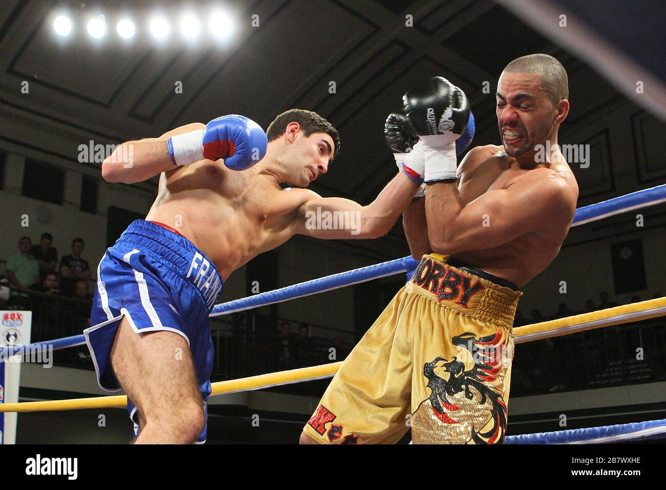 Frank Buglioni (blue shorts) defeats Paul Morby in a Super-Middleweight ...