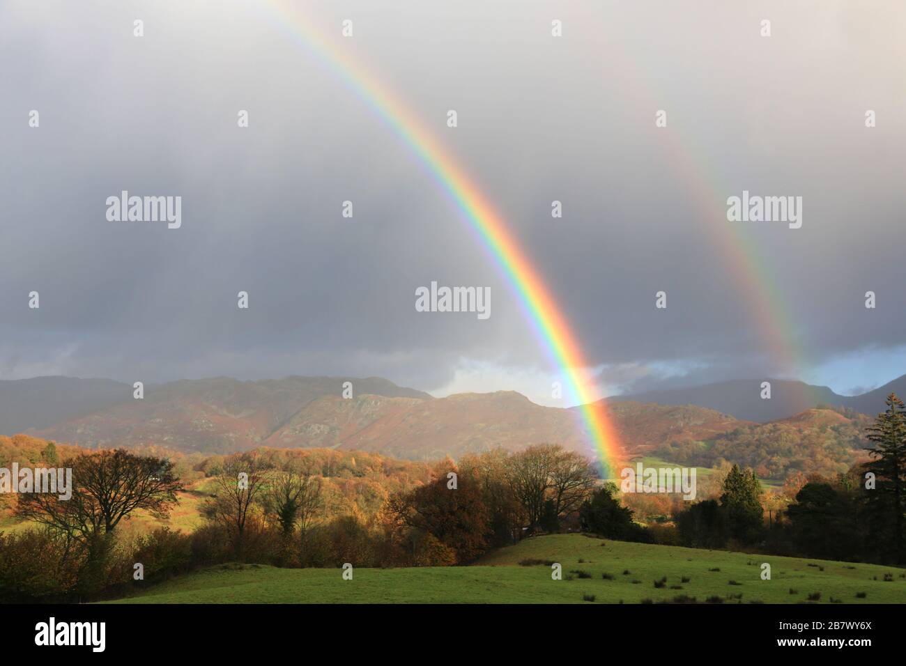 Rainbow over the Lake district fells, Cumbria, England, UK Stock Photo ...