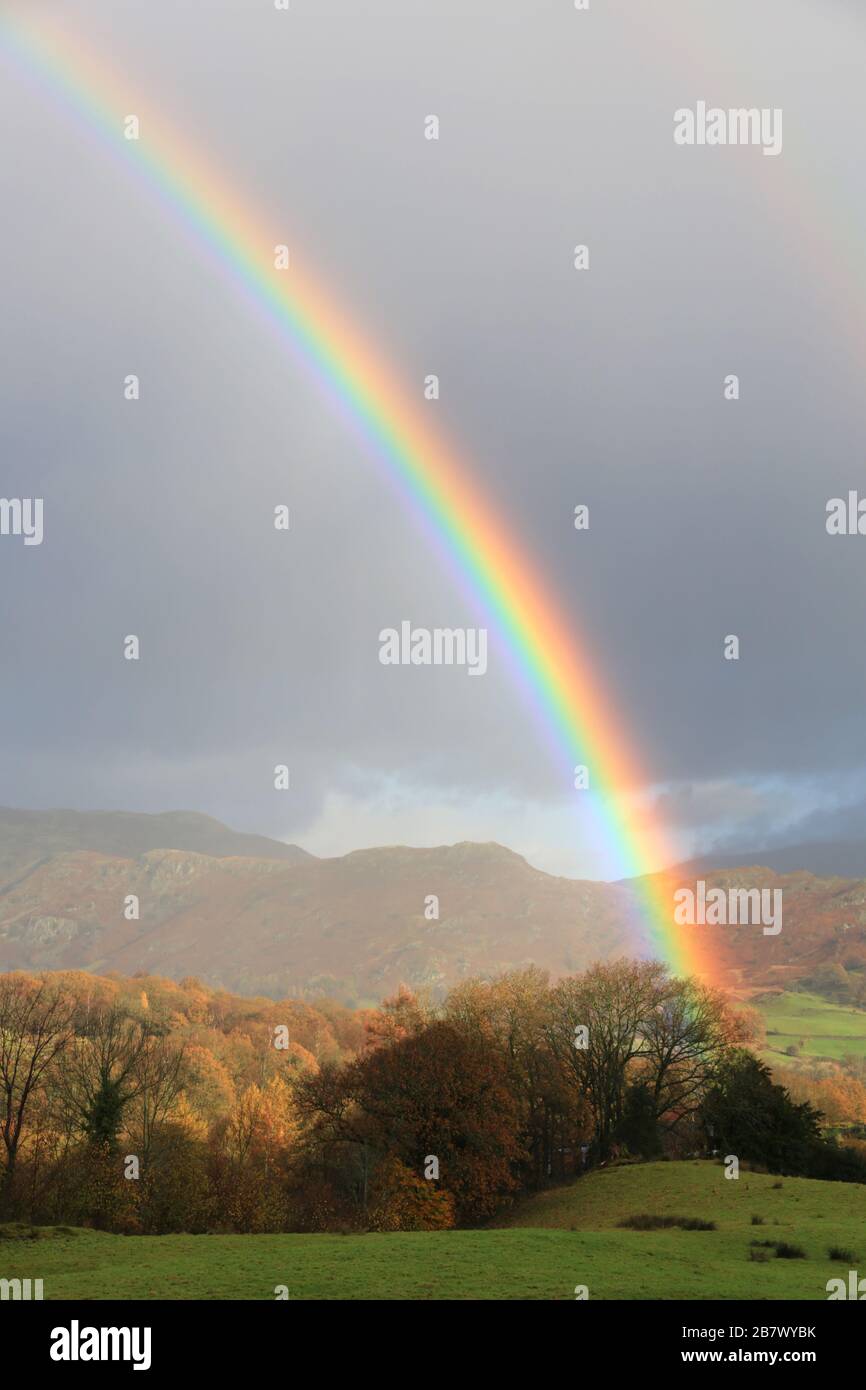 Rainbow over the Lake district fells, Cumbria, England, UK Stock Photo ...