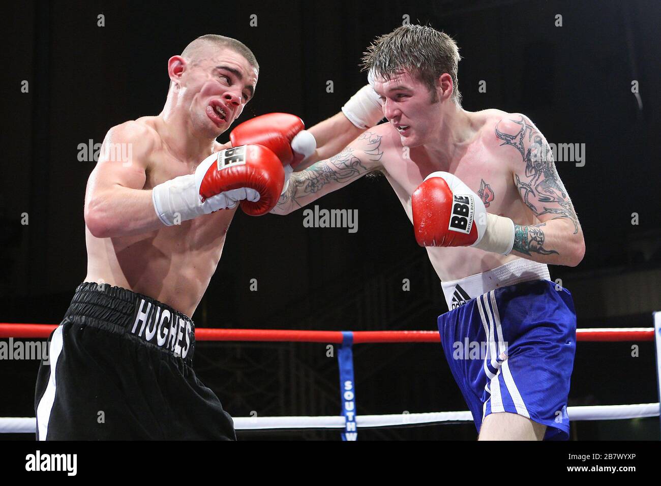 Joe Hughes (black shorts) defeats Jason Carr in a LightWelterweight ...