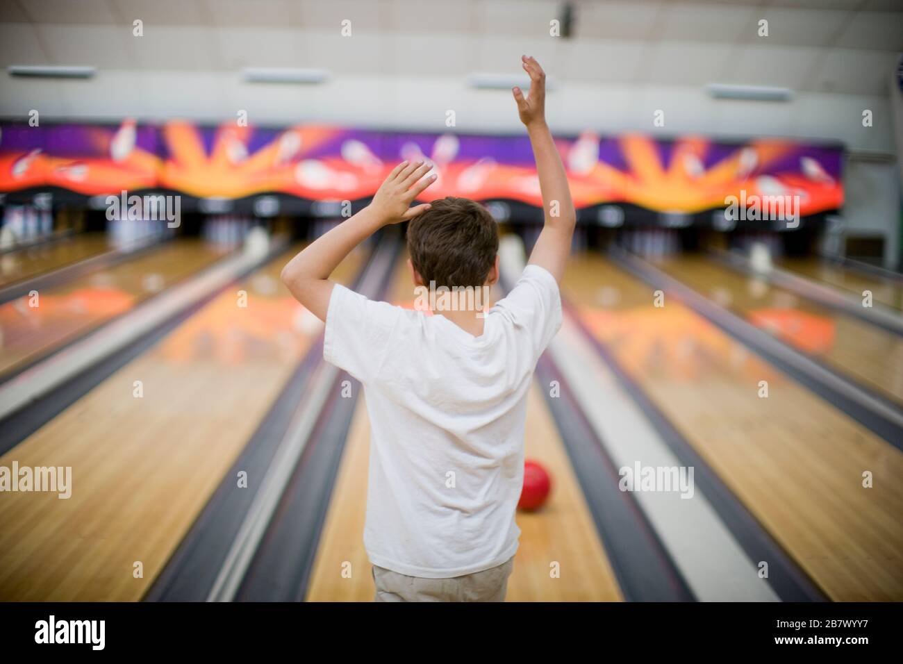 Boy bowling in bowling alley Stock Photo - Alamy