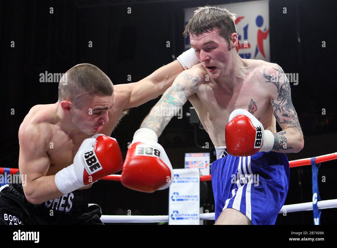 Joe Hughes (black shorts) defeats Jason Carr in a LightWelterweight ...