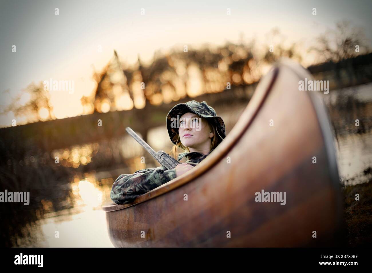 Young woman with hunting rifle hi-res stock photography and images - Alamy